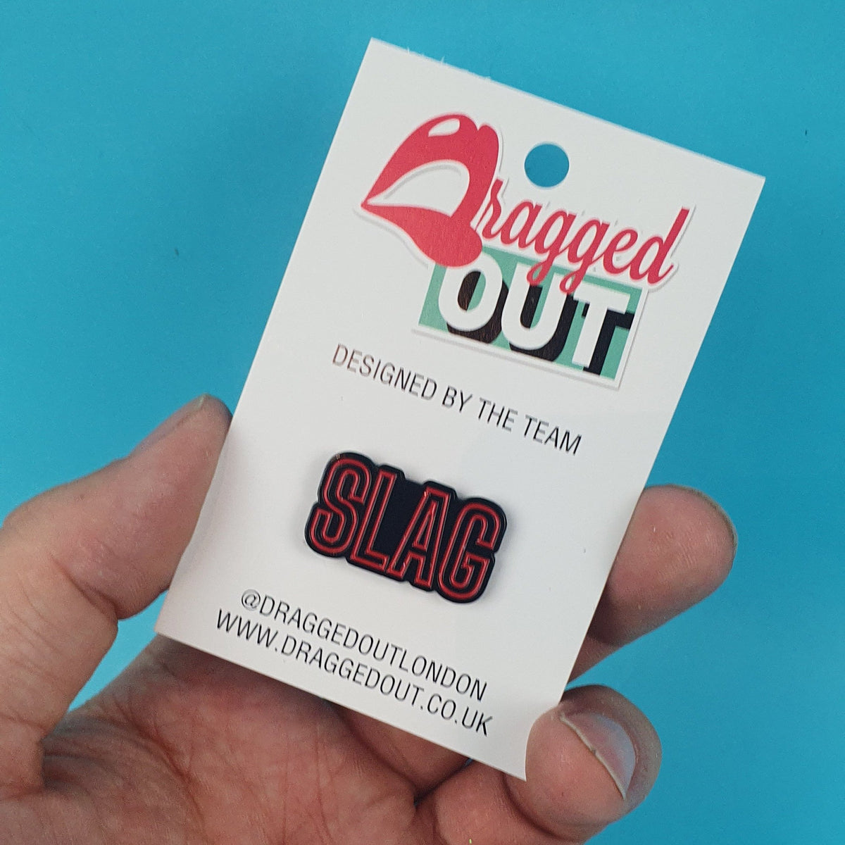 Slag Pin Badge – Dragged Out
